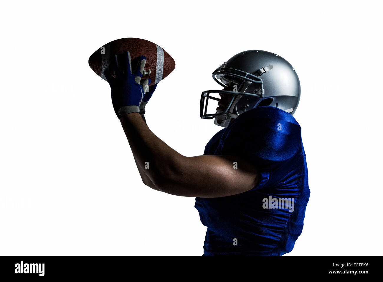 American football player catching ball Stock Photo - Alamy