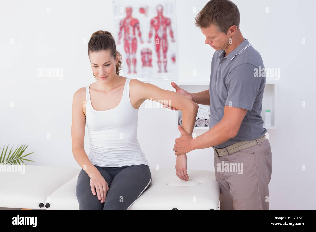 Doctor examining his patient arm Stock Photo - Alamy