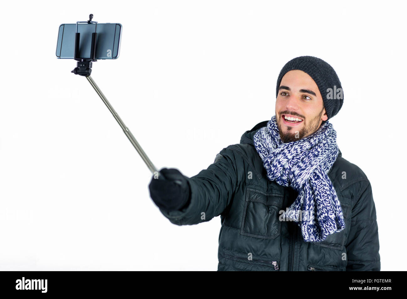 Holding a selfie stick Cut Out Stock Images & Pictures - Alamy