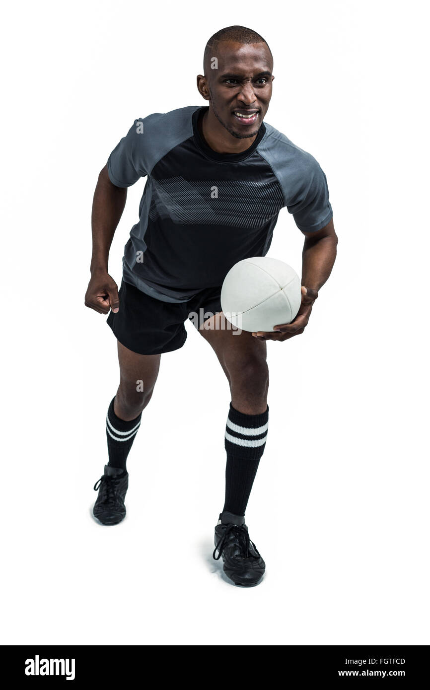 Rugby player with ball standing in position Stock Photo - Alamy
