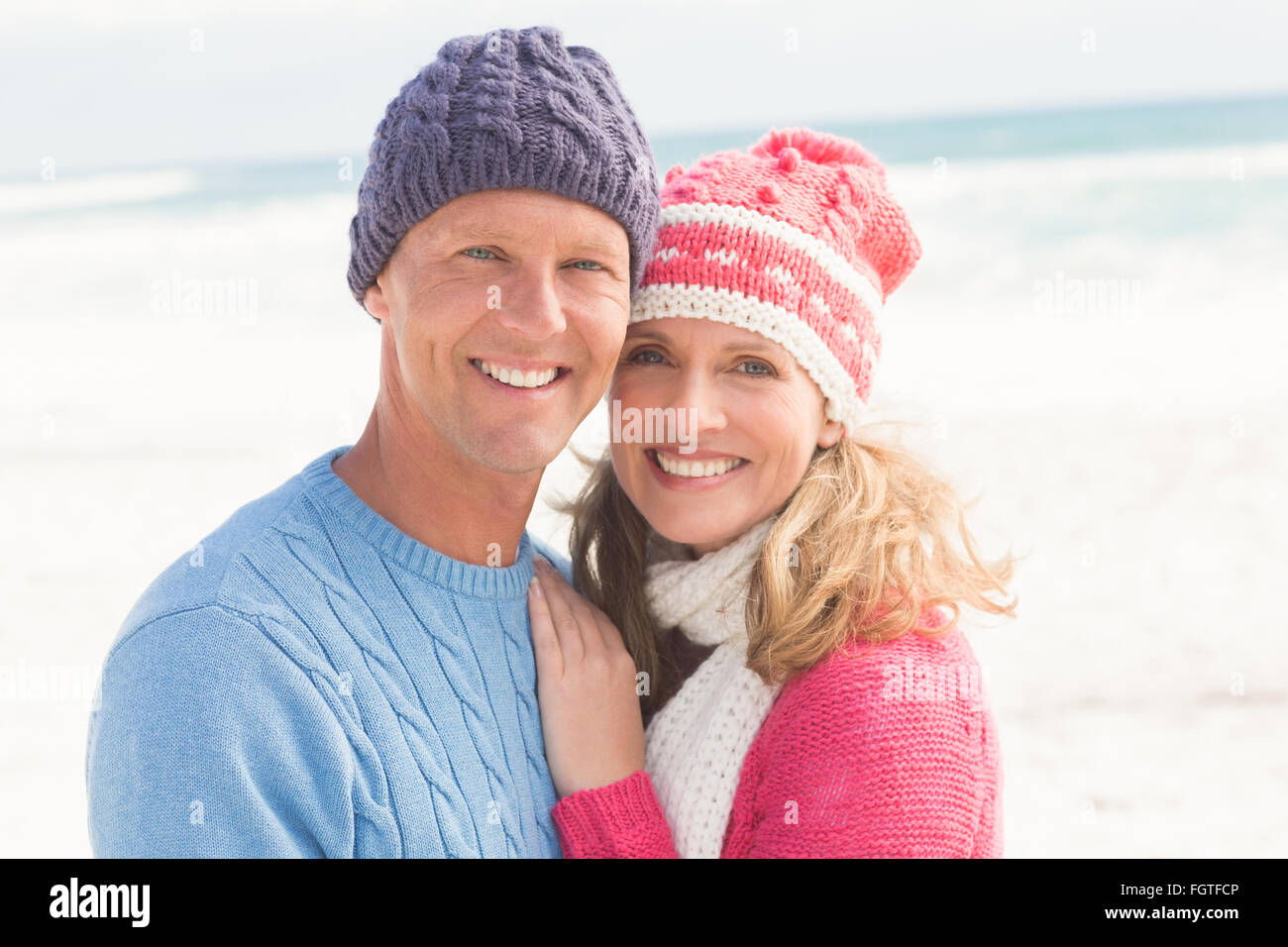 Smiling happy couple hugging each other Stock Photo - Alamy