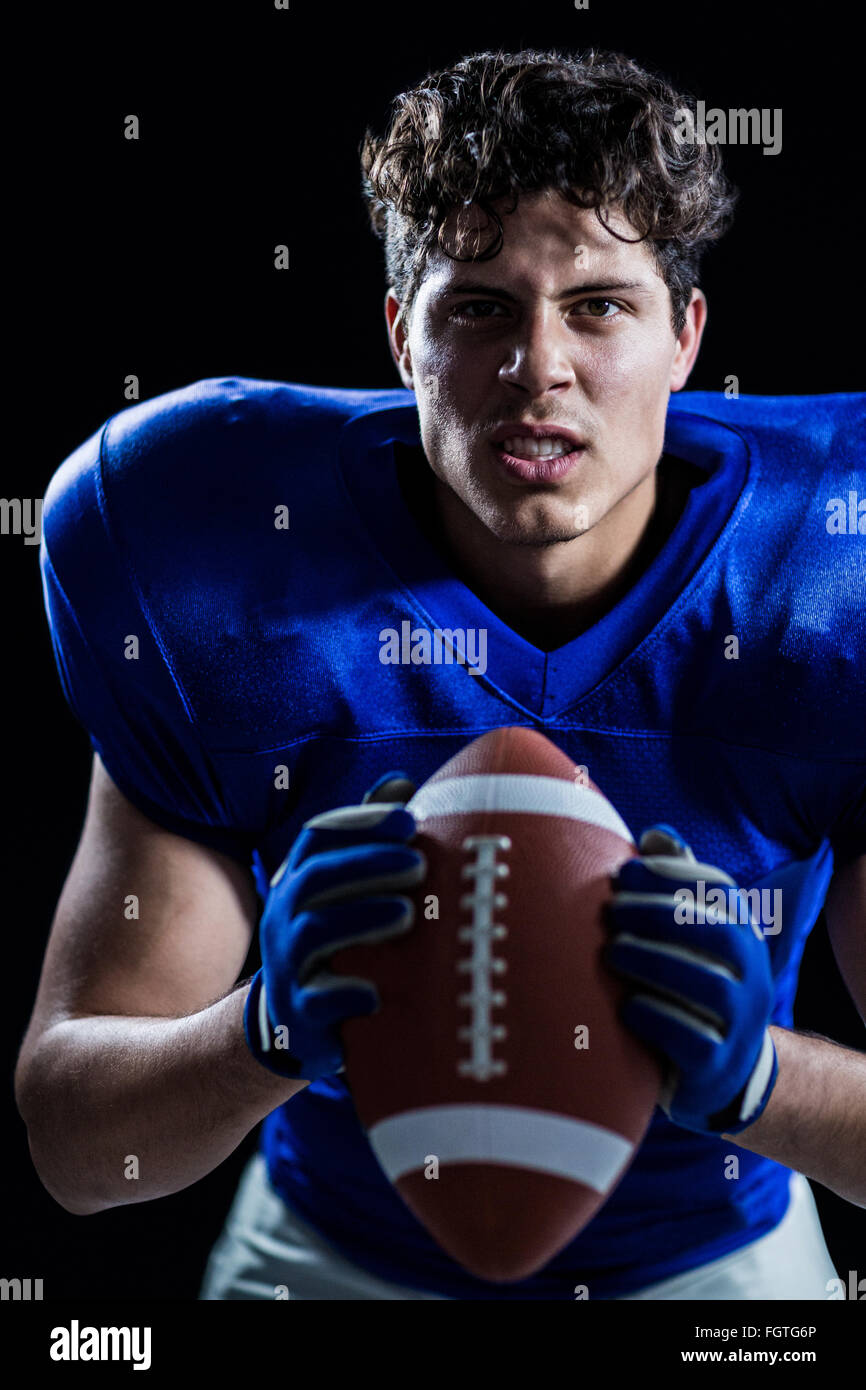 Portrait of aggressive American football player Stock Photo - Alamy