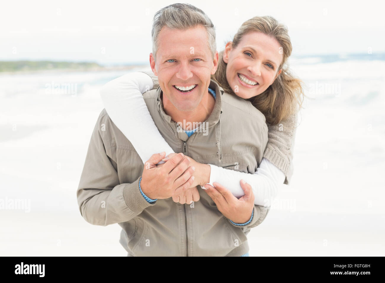 Smiling couple holding one hi-res stock photography and images - Alamy