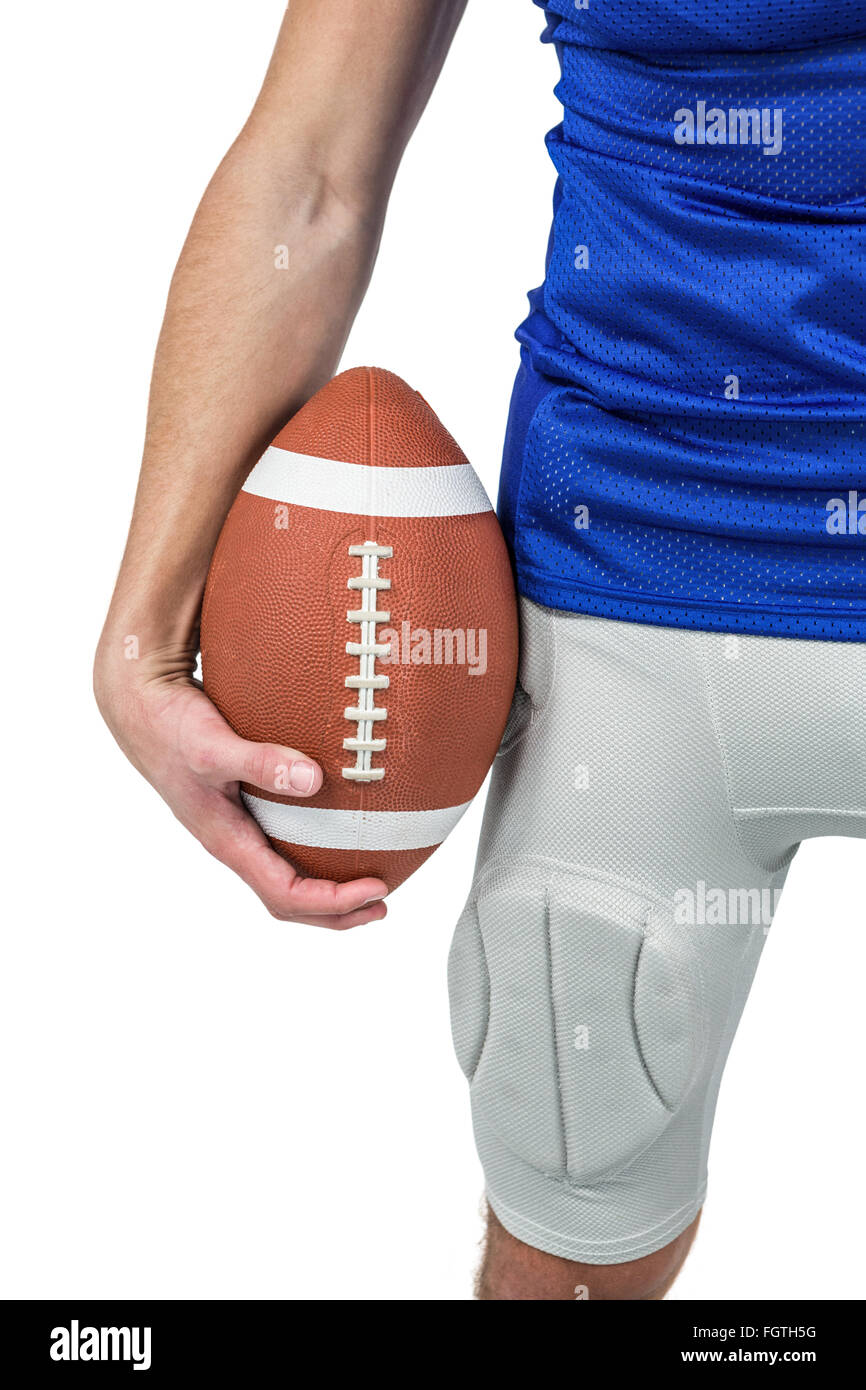 Sports player holding ball Stock Photo - Alamy