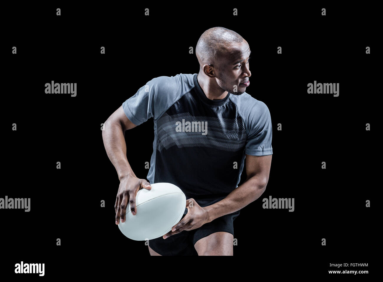 Athlete running with rugby ball Stock Photo - Alamy