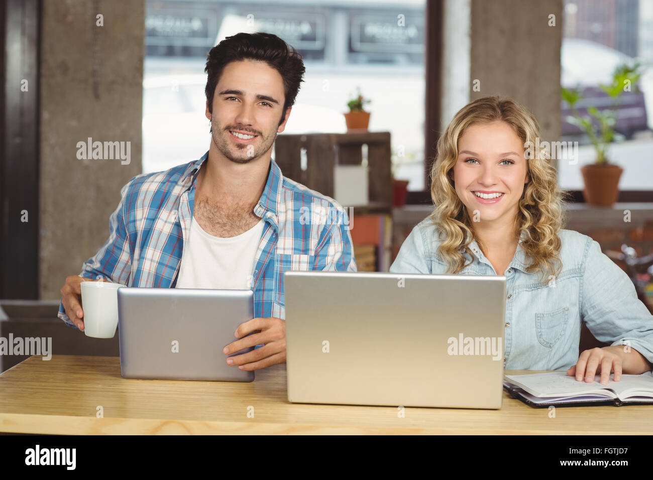 Business people posing while working Stock Photo - Alamy