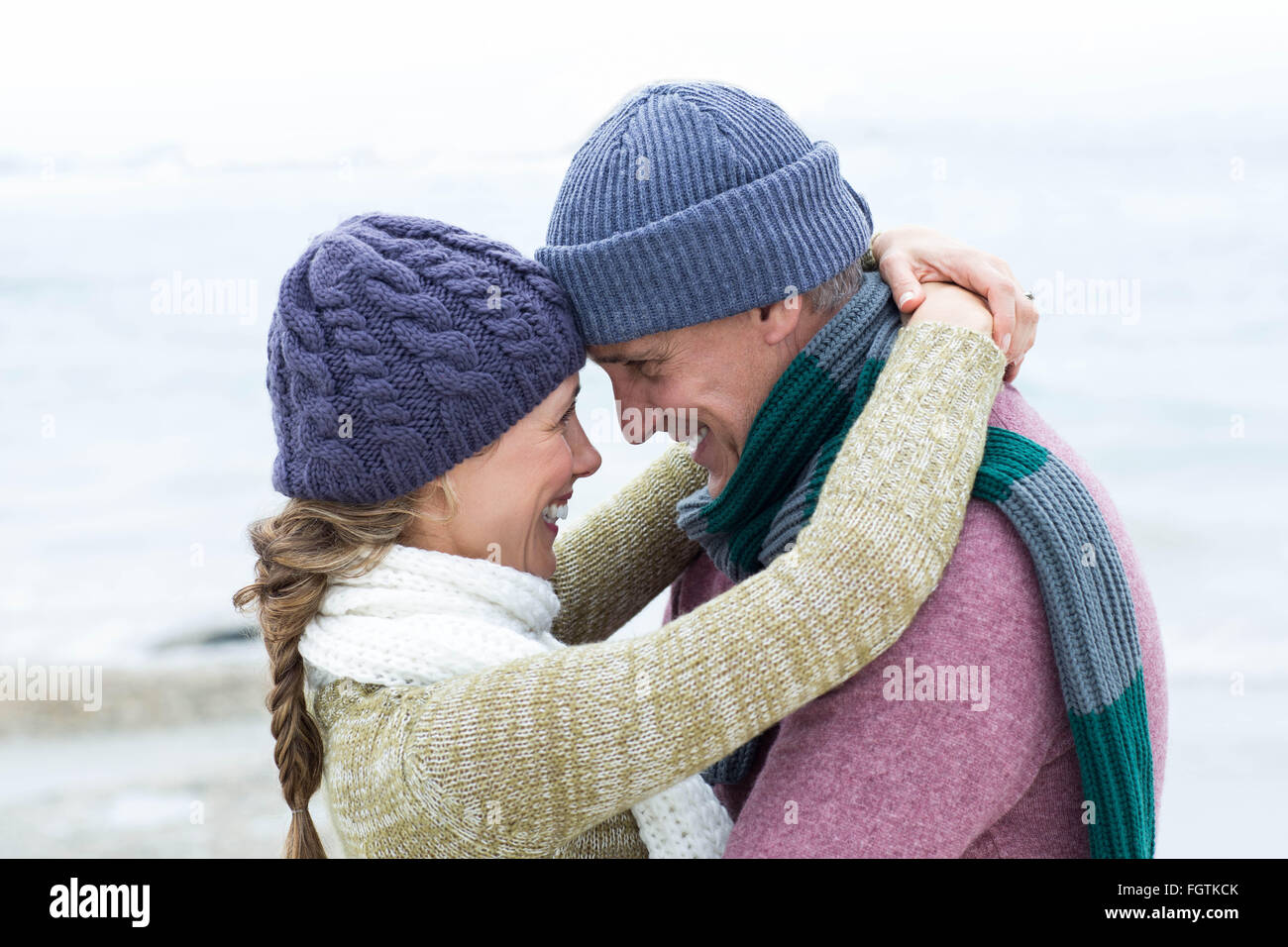 Smiling happy couple hugging each other Stock Photo - Alamy