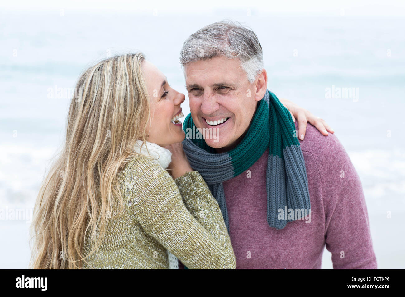 Smiling happy couple hugging each other Stock Photo - Alamy