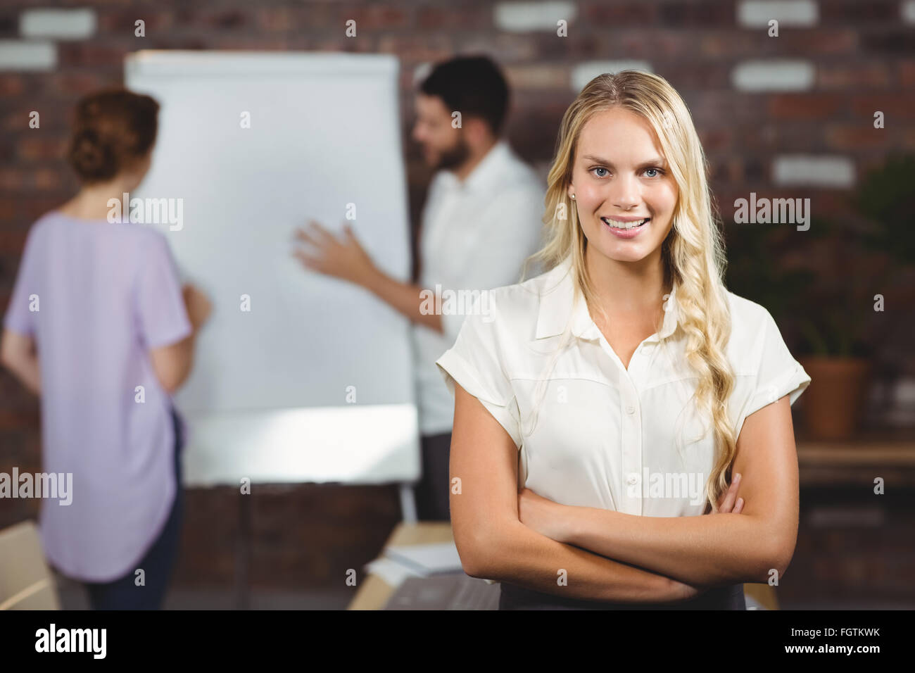 Portrait of smiling business standing Stock Photo - Alamy