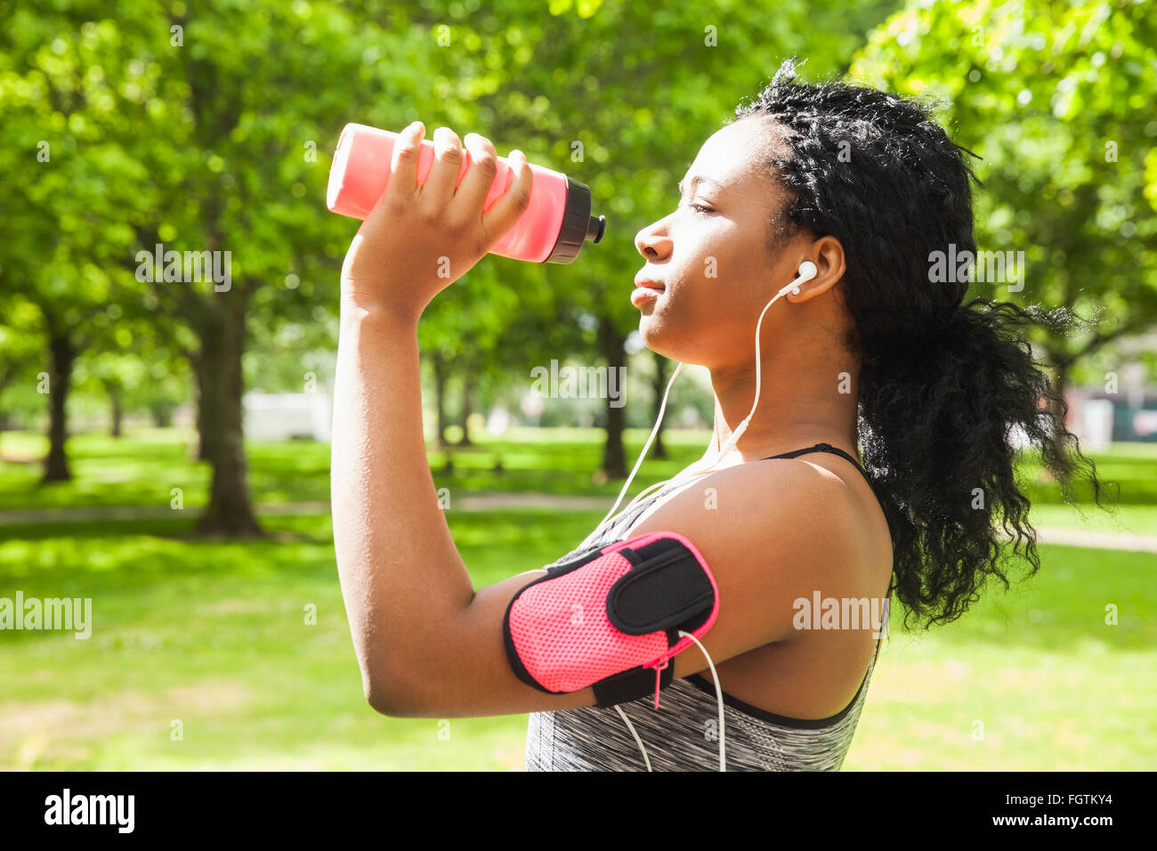 Fit woman taking a drink Stock Photo - Alamy