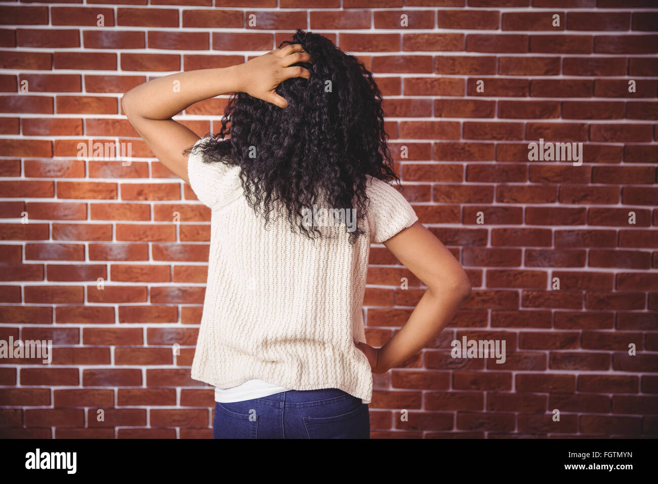 Young woman scratching her head Stock Photo - Alamy