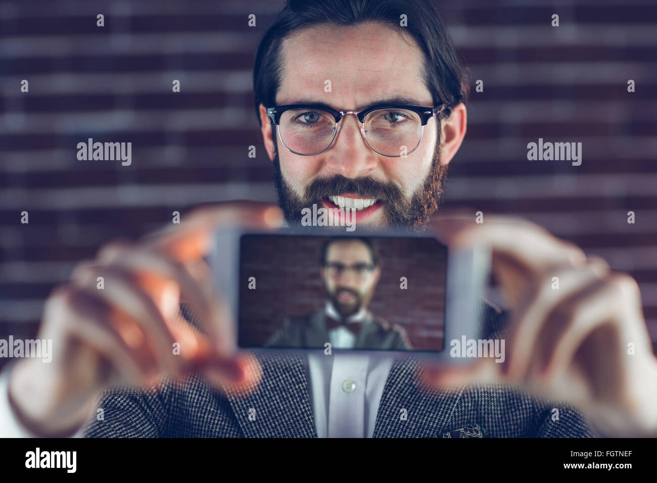 Portrait of smiling man taking picture of himself Stock Photo - Alamy