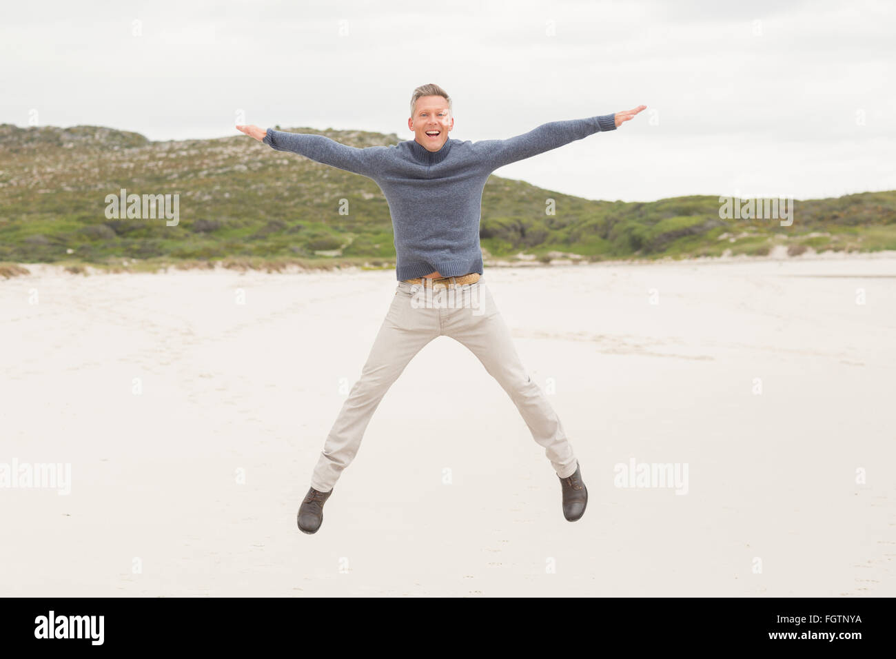 Man performing a jumping jack Stock Photo - Alamy