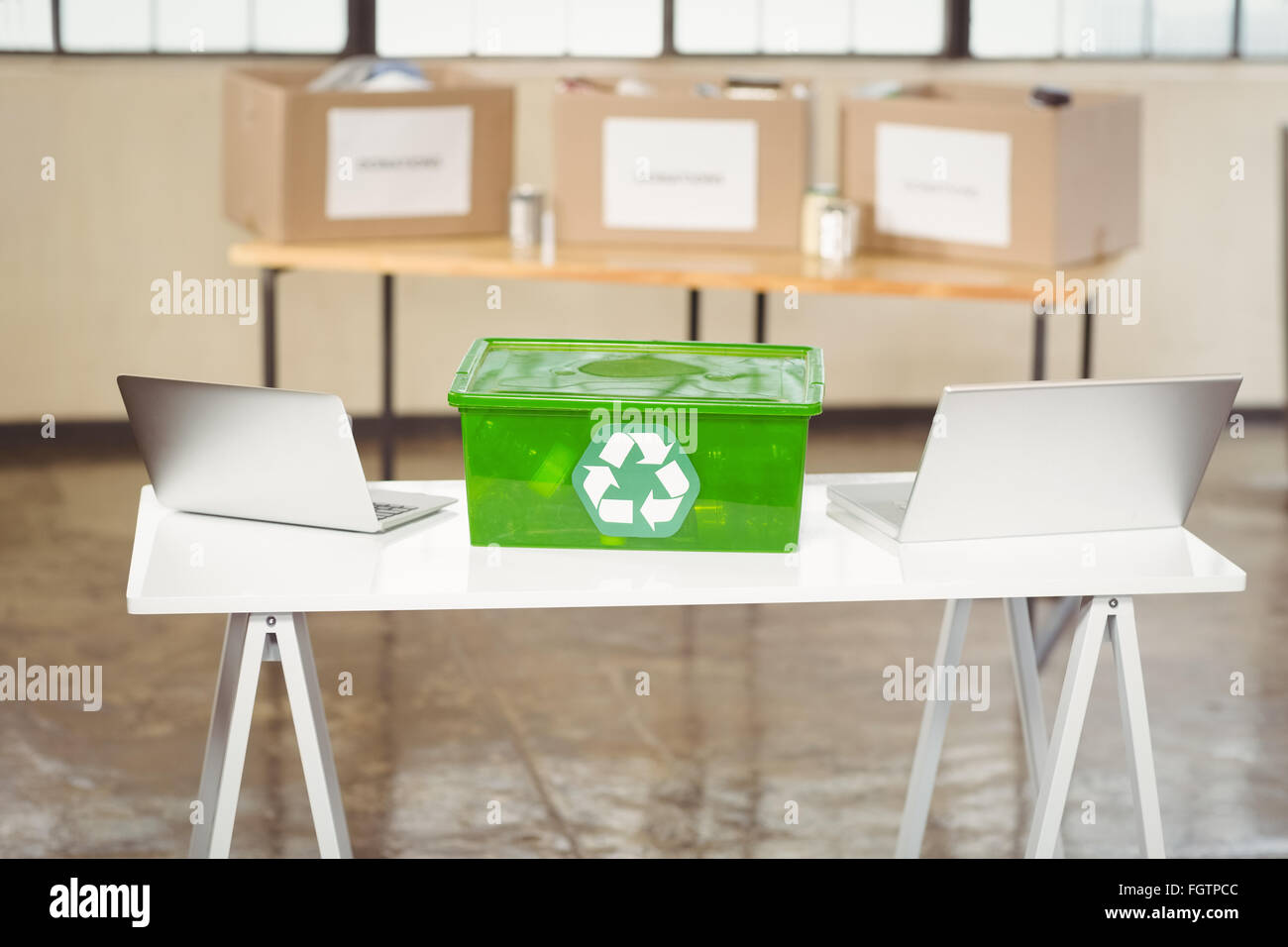 Recycling box amidst laptop Stock Photo - Alamy