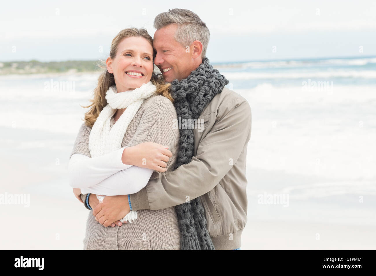 Happy couple standing together Stock Photo - Alamy