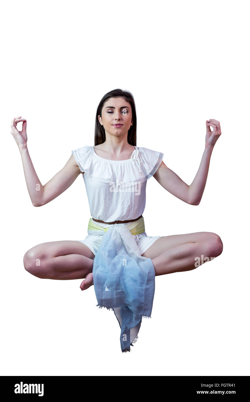 Girl in white dress floating in air Stock Photo - Alamy