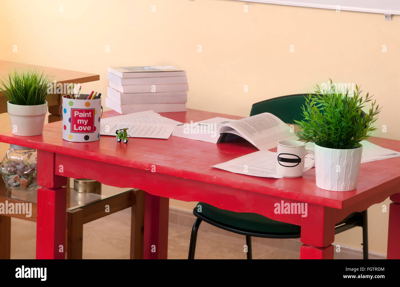 Red desk with objects Stock Photo - Alamy