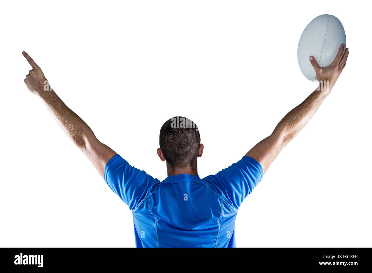 Rear view of rugby player holding ball with arms raised Stock Photo - Alamy