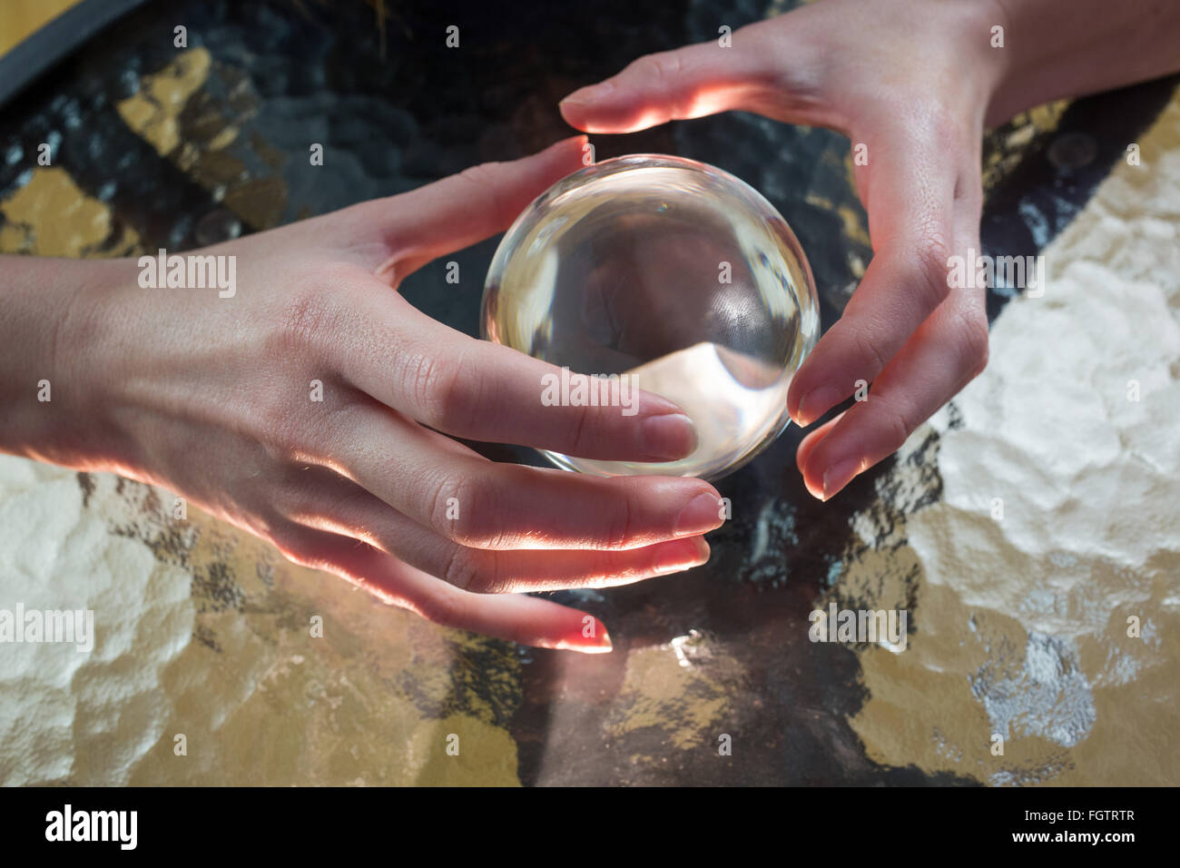 Fortune teller using crystal ball Stock Photo - Alamy