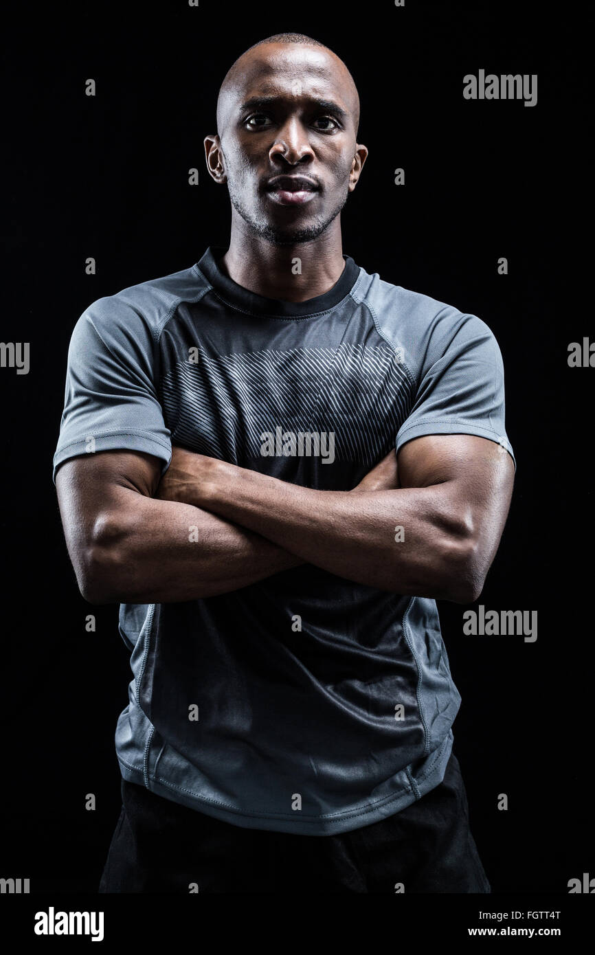 Portrait of confident rugby player with arms crossed Stock Photo - Alamy