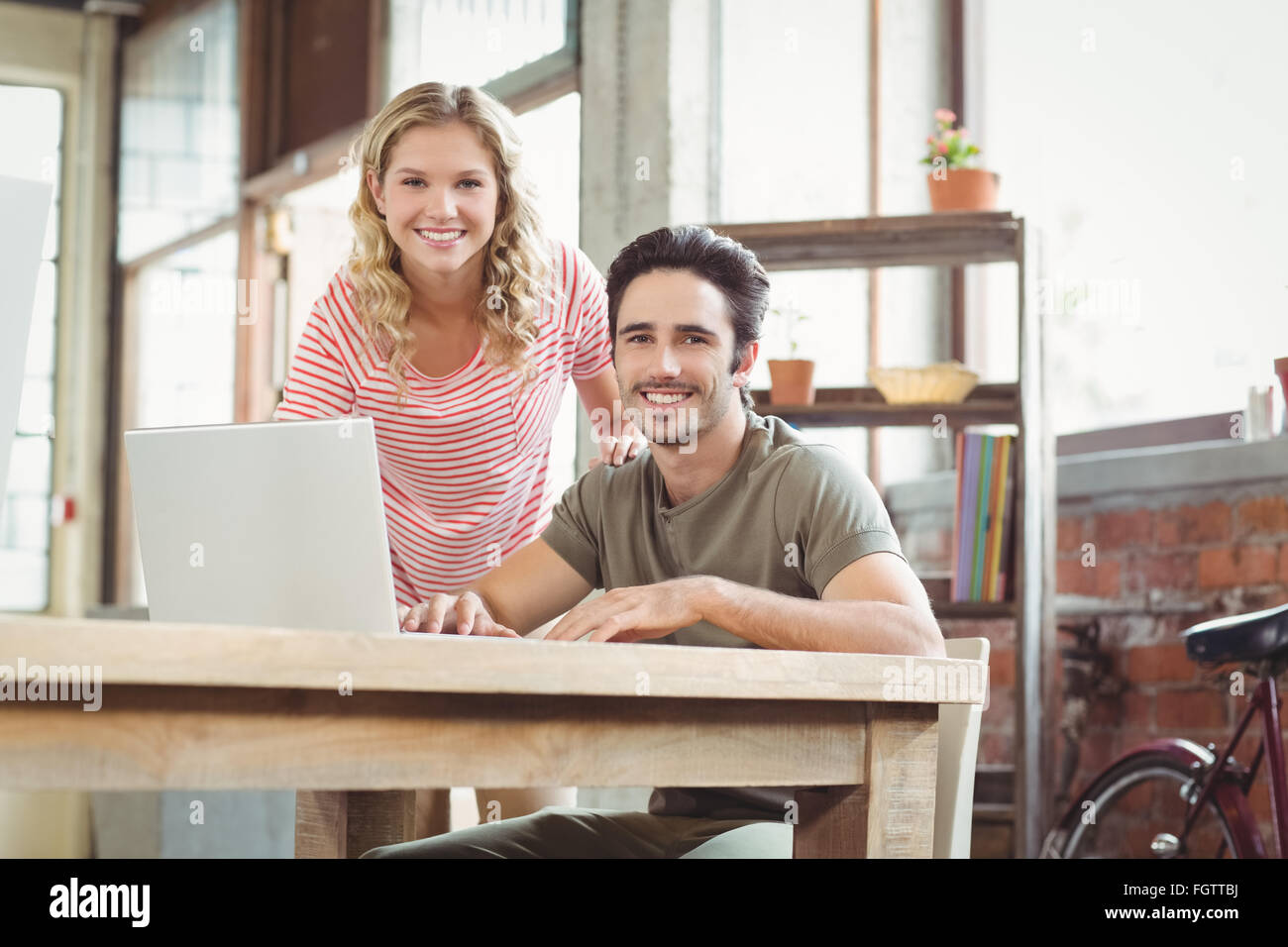 Portrait of smiling colleagues in bright office Stock Photo - Alamy