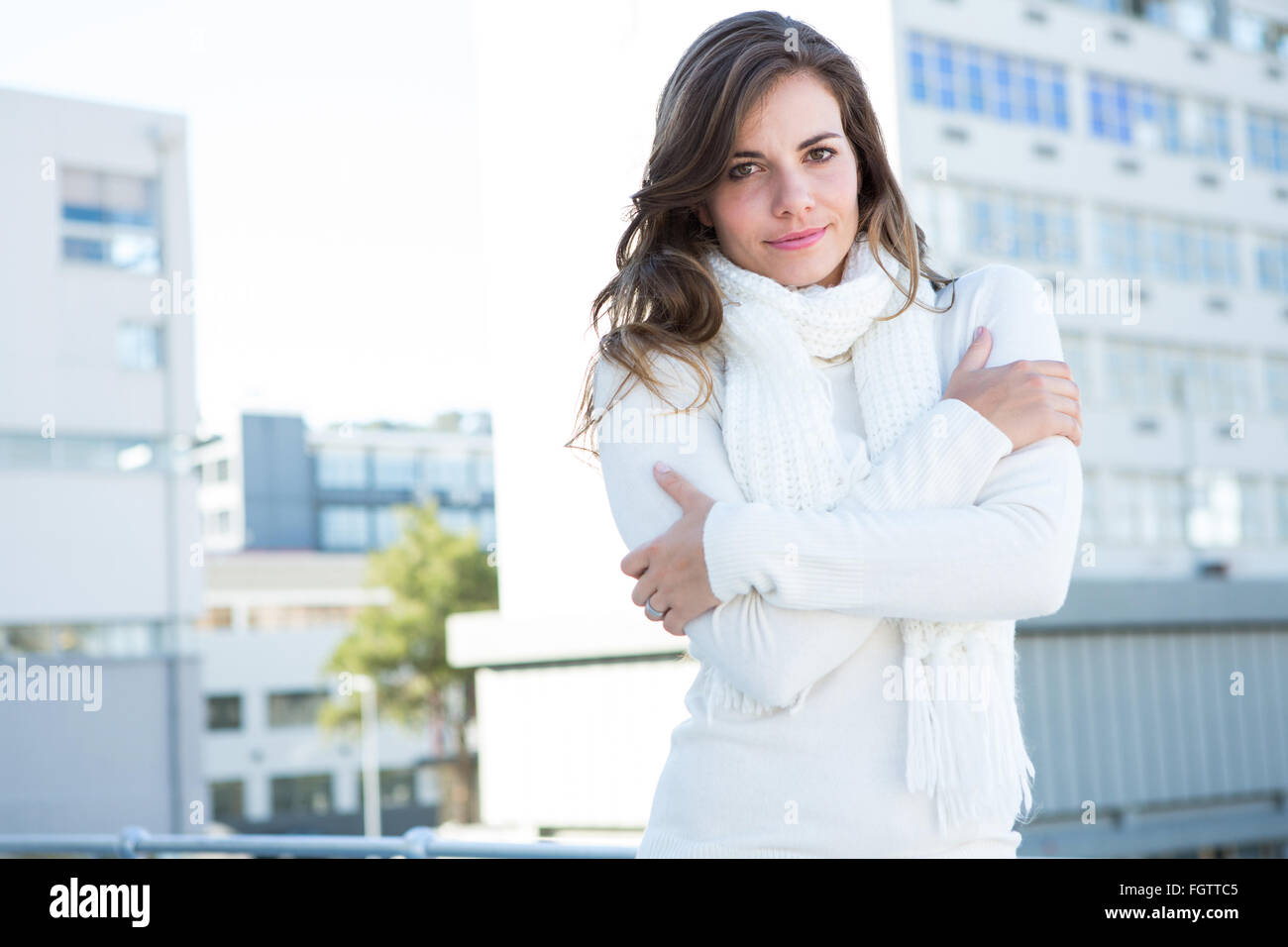 Pretty woman with warm clothes looking at camera Stock Photo - Alamy