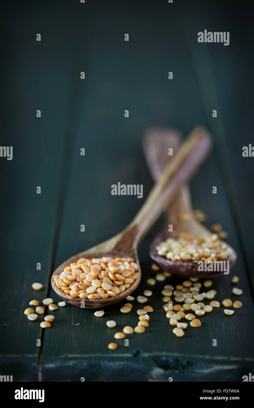 wooden spoon with yellow split peas Stock Photo - Alamy