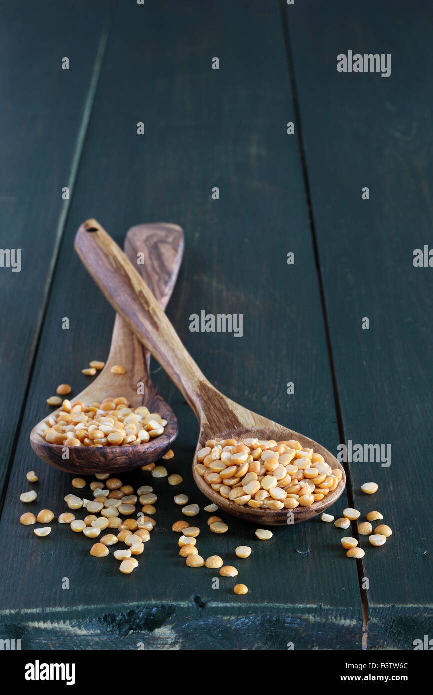wooden spoon with yellow split peas Stock Photo - Alamy