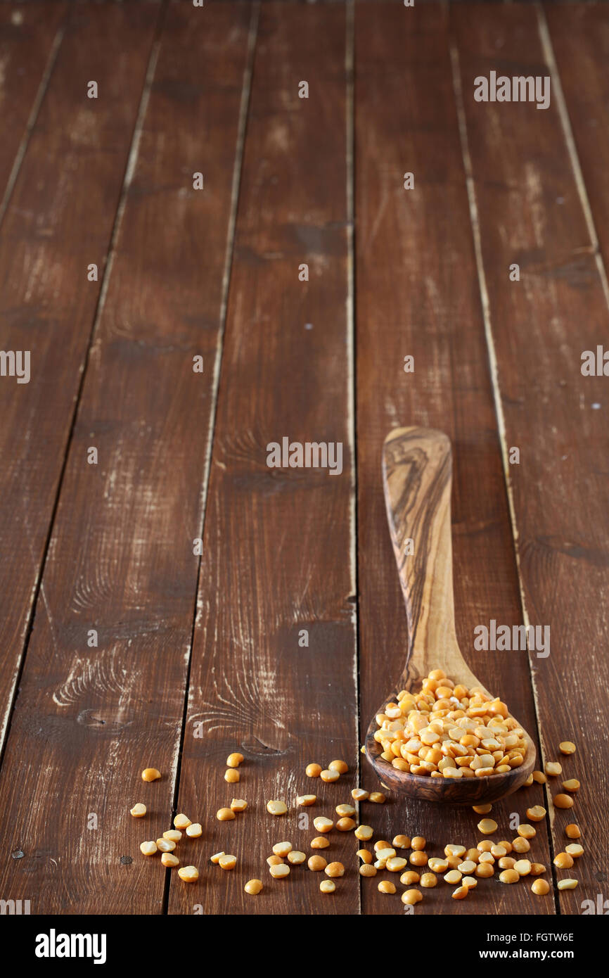 wooden spoon with yellow split peas Stock Photo - Alamy