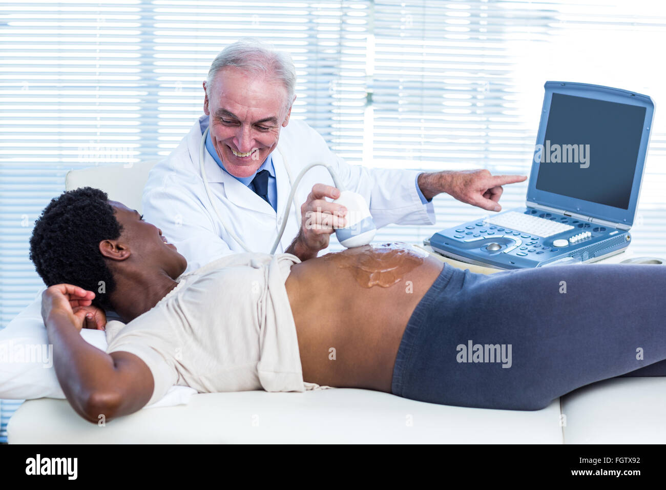Male doctor examining results ultrasound hi-res stock photography and ...