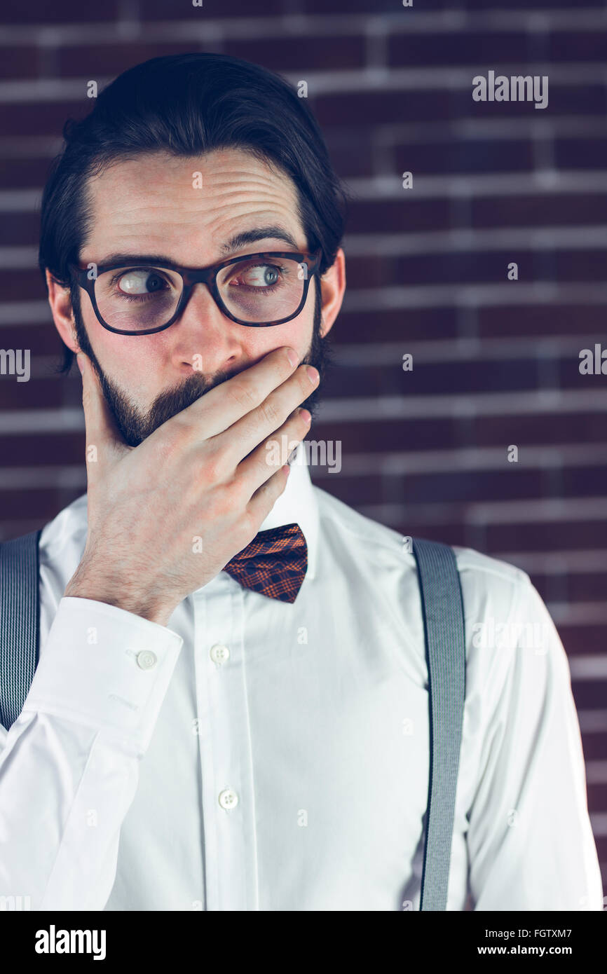 Nervous man covering mouth Stock Photo - Alamy