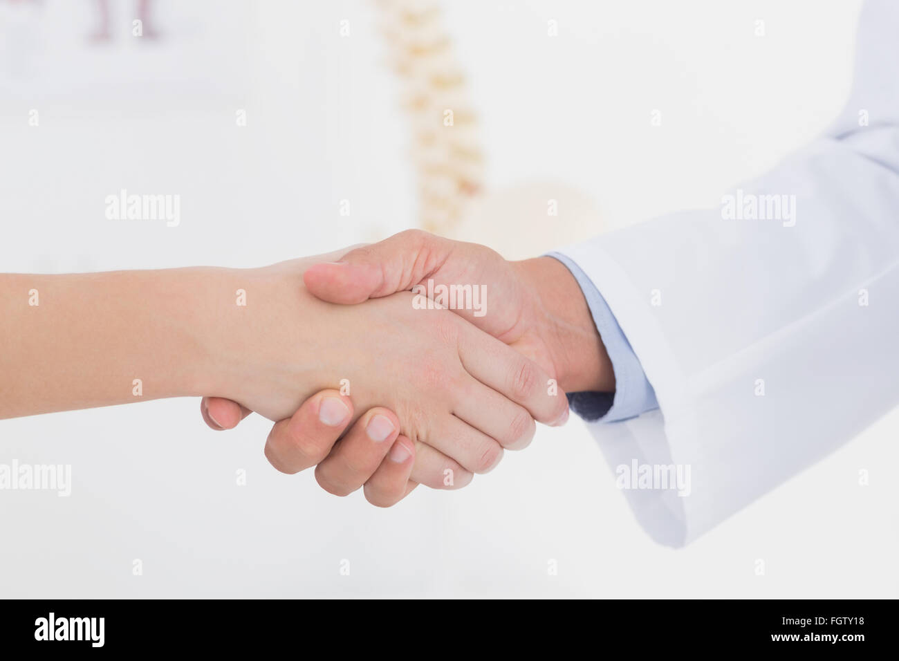 Patient shaking hands with doctor Stock Photo - Alamy