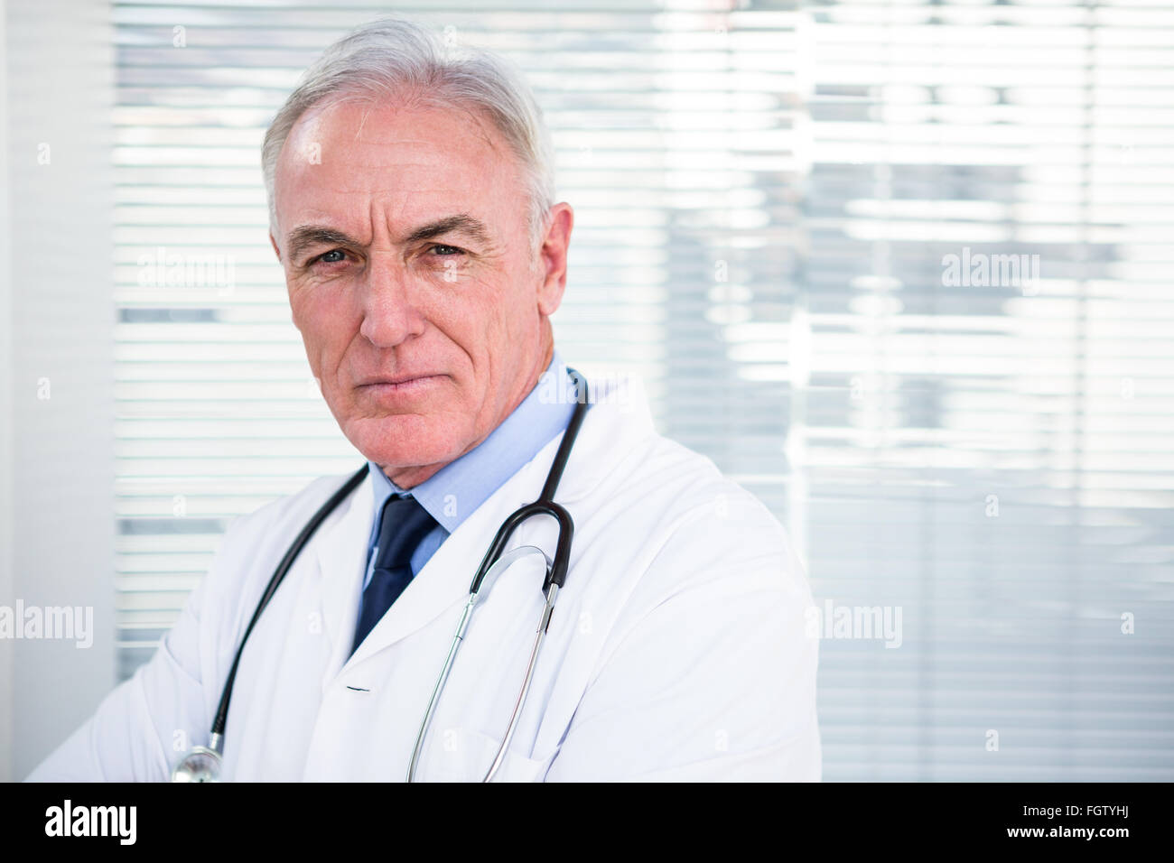 Portrait of serious doctor with stethoscope Stock Photo - Alamy
