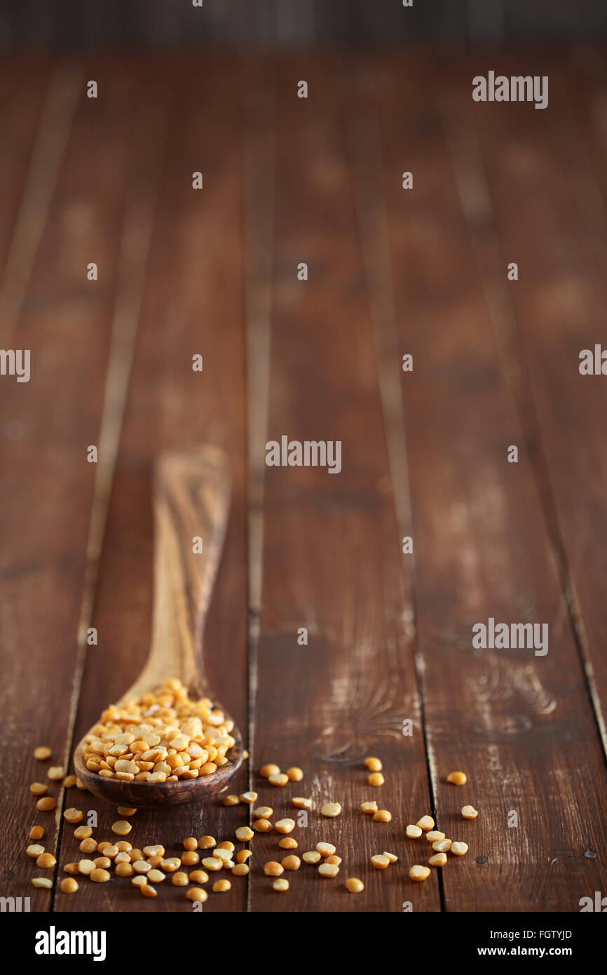 wooden spoon with yellow split peas Stock Photo - Alamy