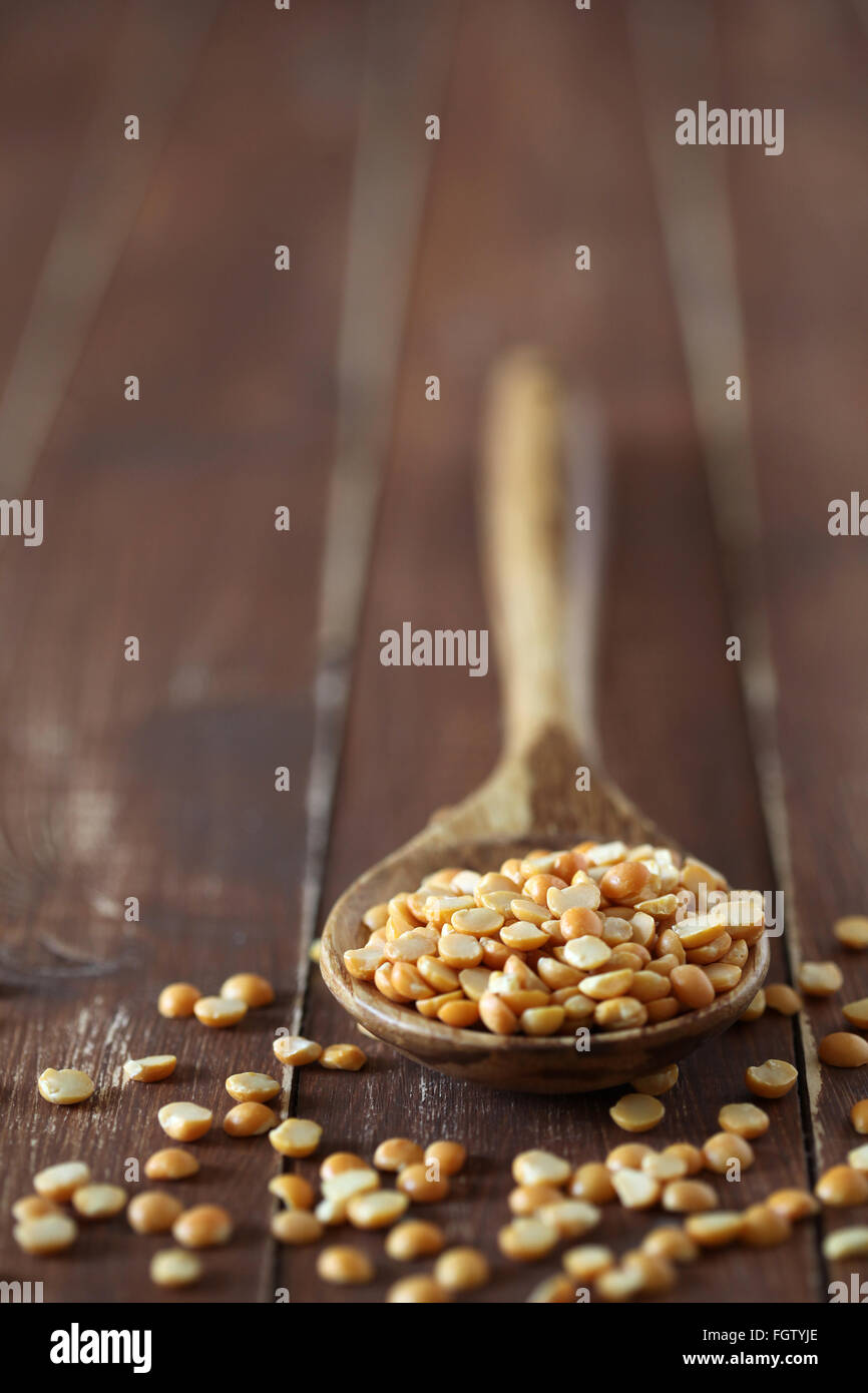 wooden spoon with yellow split peas Stock Photo - Alamy