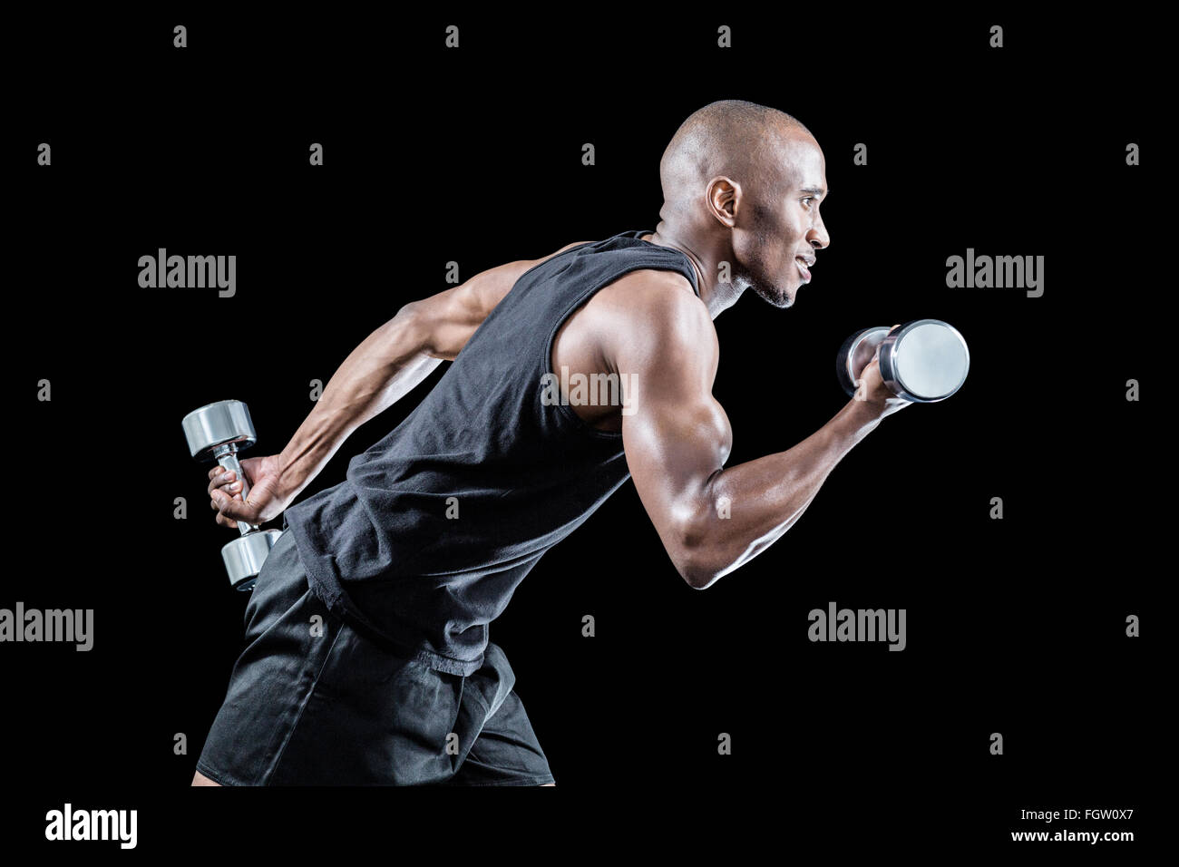 Side view of muscular man running while holding dumbbell Stock Photo ...