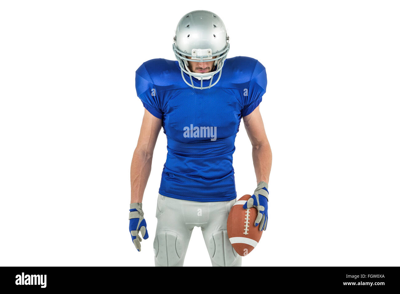 Confident American football player looking down Stock Photo - Alamy
