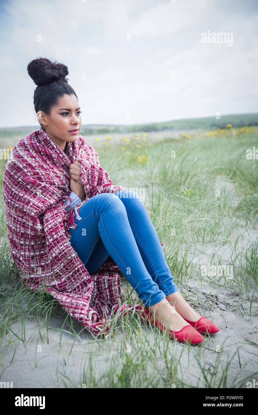 Beautiful woman wrapped up in warm clothing Stock Photo - Alamy