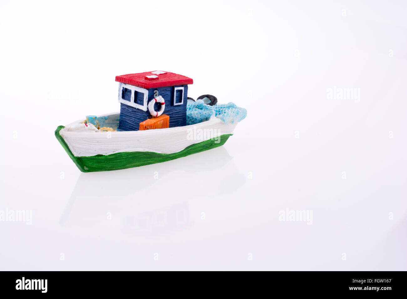 Small Ship model on a white background Stock Photo - Alamy