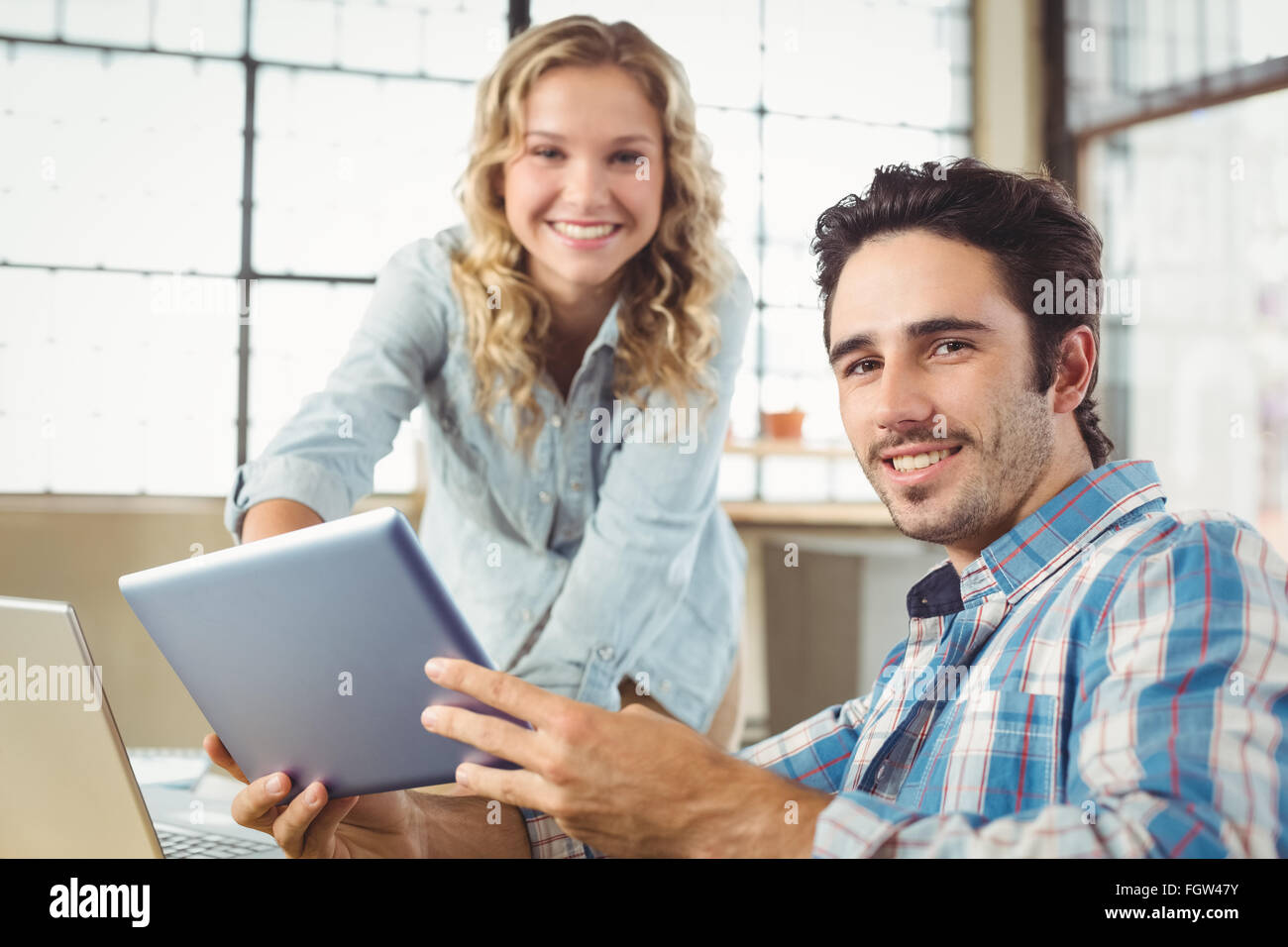Portrait of business people working at office Stock Photo - Alamy