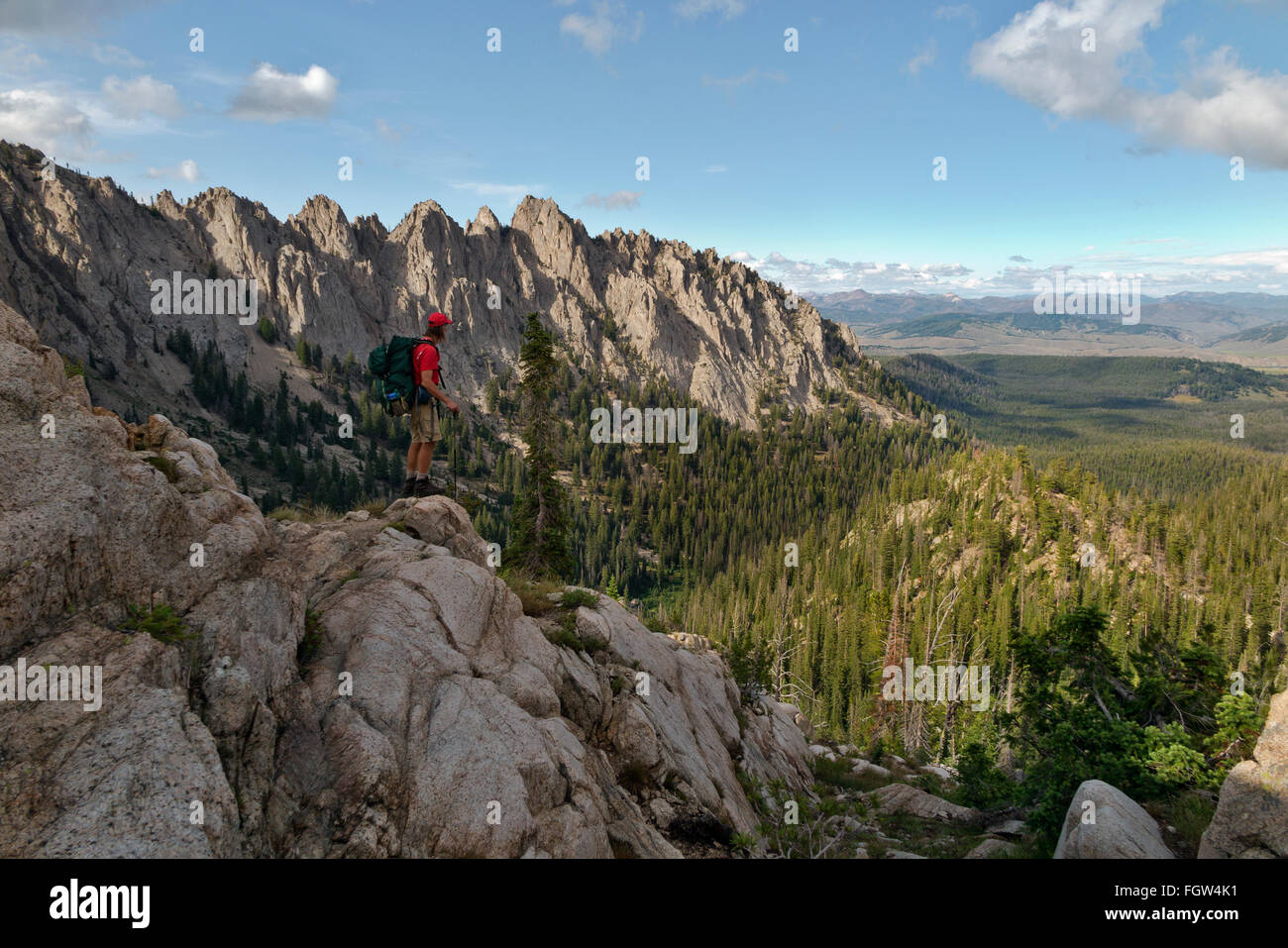 ID00361-00...IDAHO - Hiker looking over the Iron Creek Basin from the ...