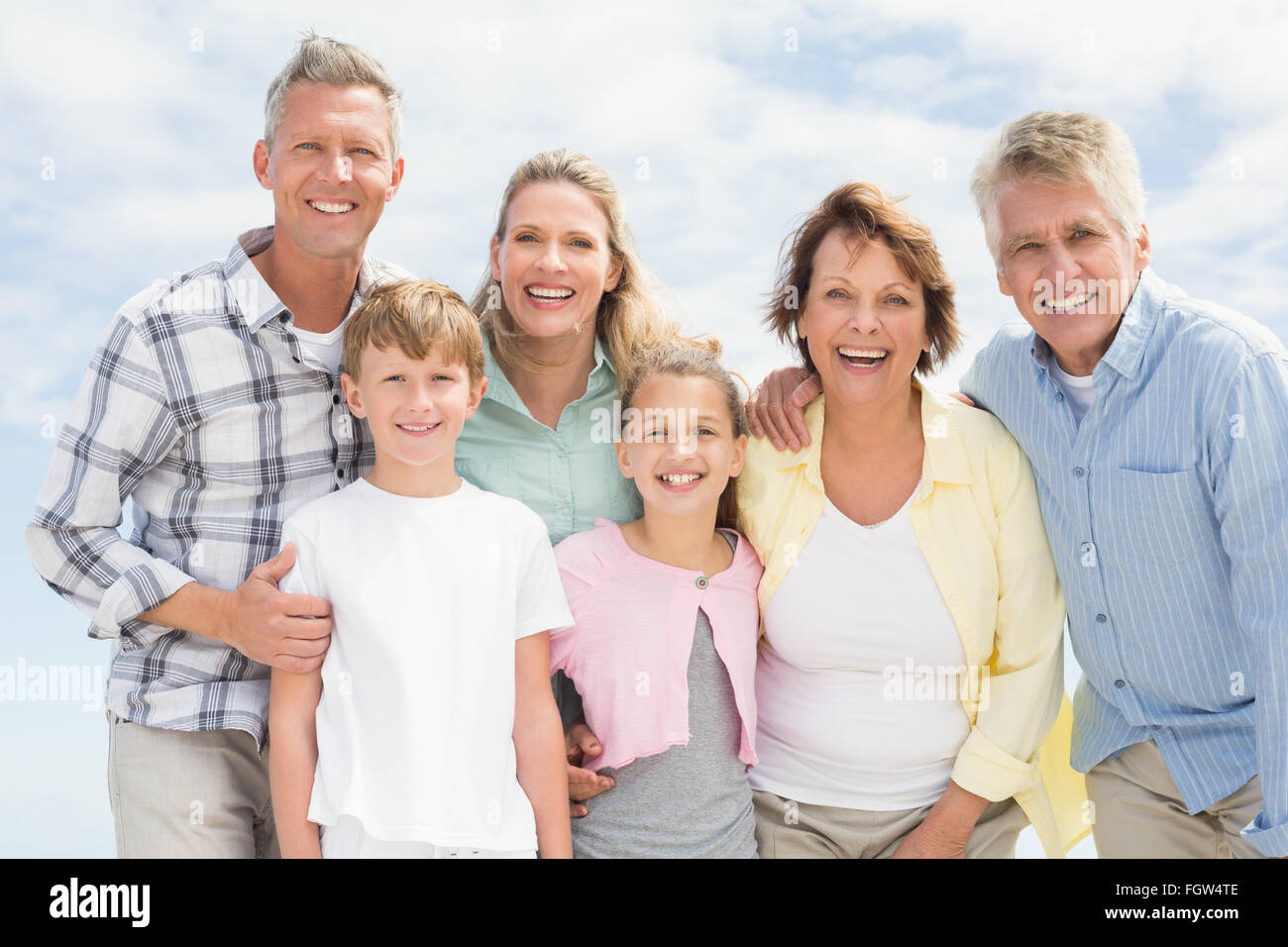 Multi generation family happy and smiling Stock Photo - Alamy