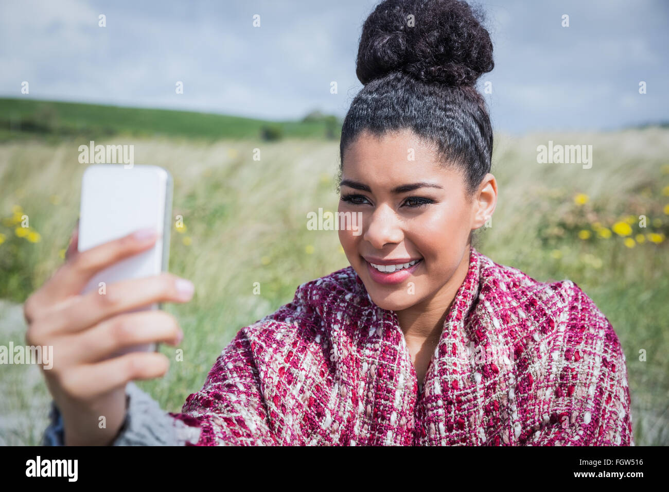 Beautiful woman using her smartphone Stock Photo - Alamy