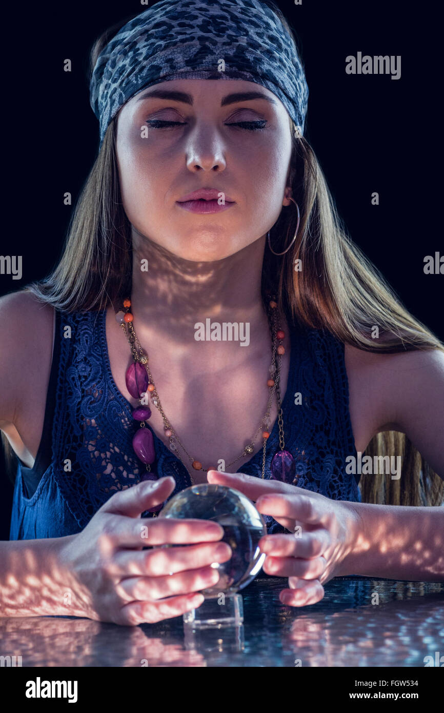 Fortune teller using crystal ball Stock Photo - Alamy