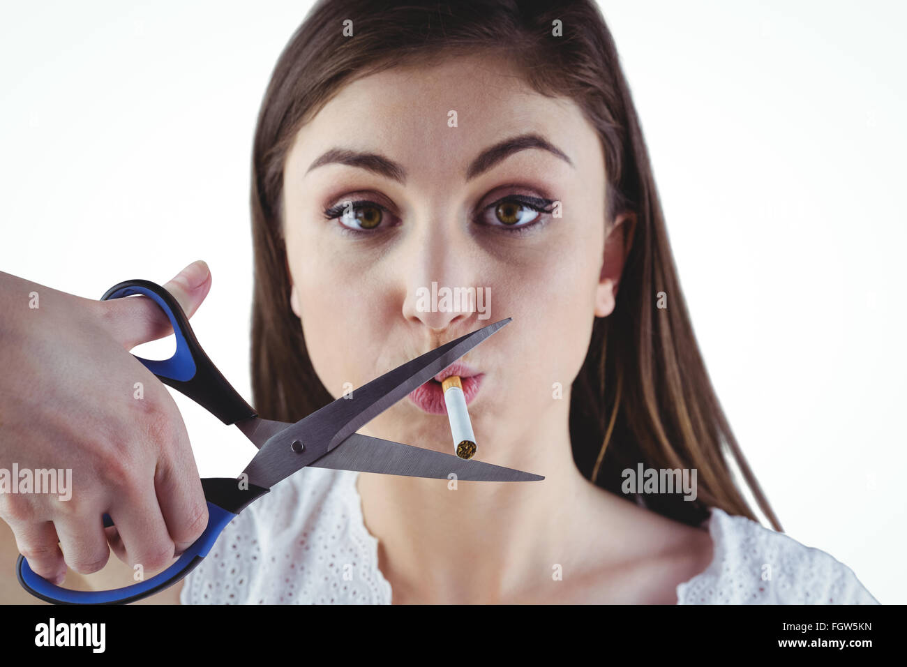 Woman cutting cigarette with scissors Stock Photo - Alamy
