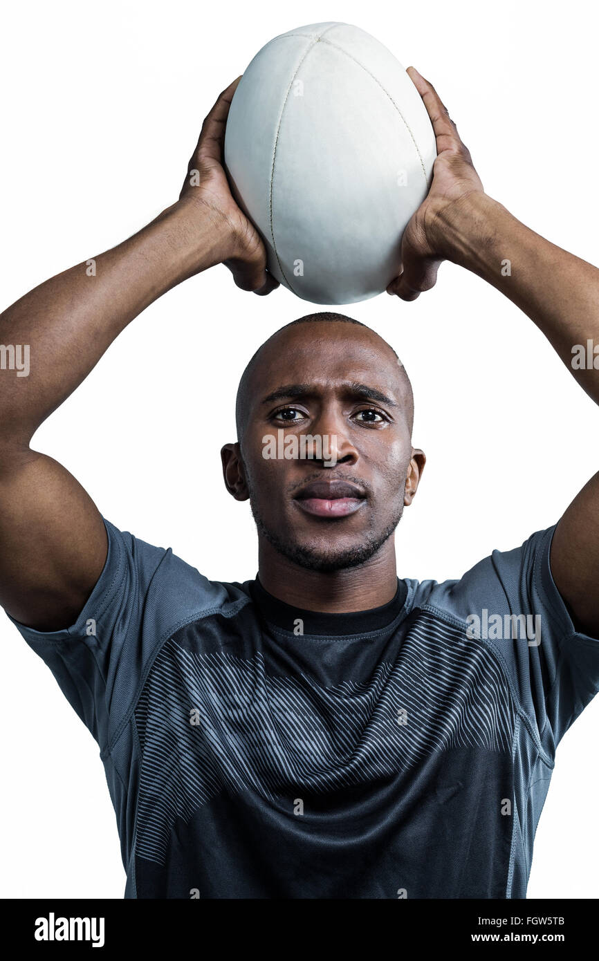 Sportsman throwing rugby ball Stock Photo - Alamy