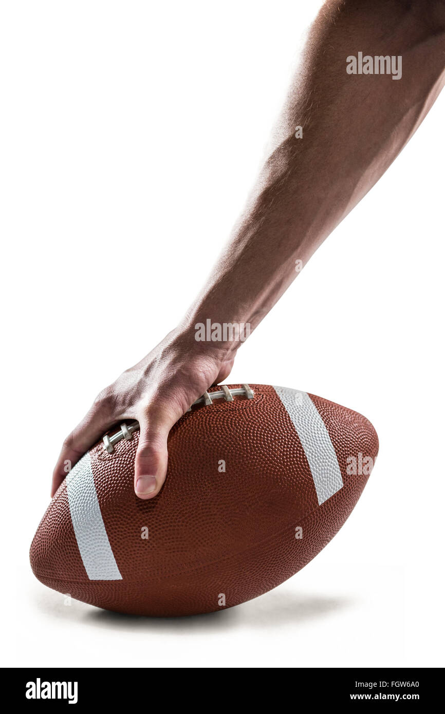 Cropped image of sports player holding ball Stock Photo - Alamy