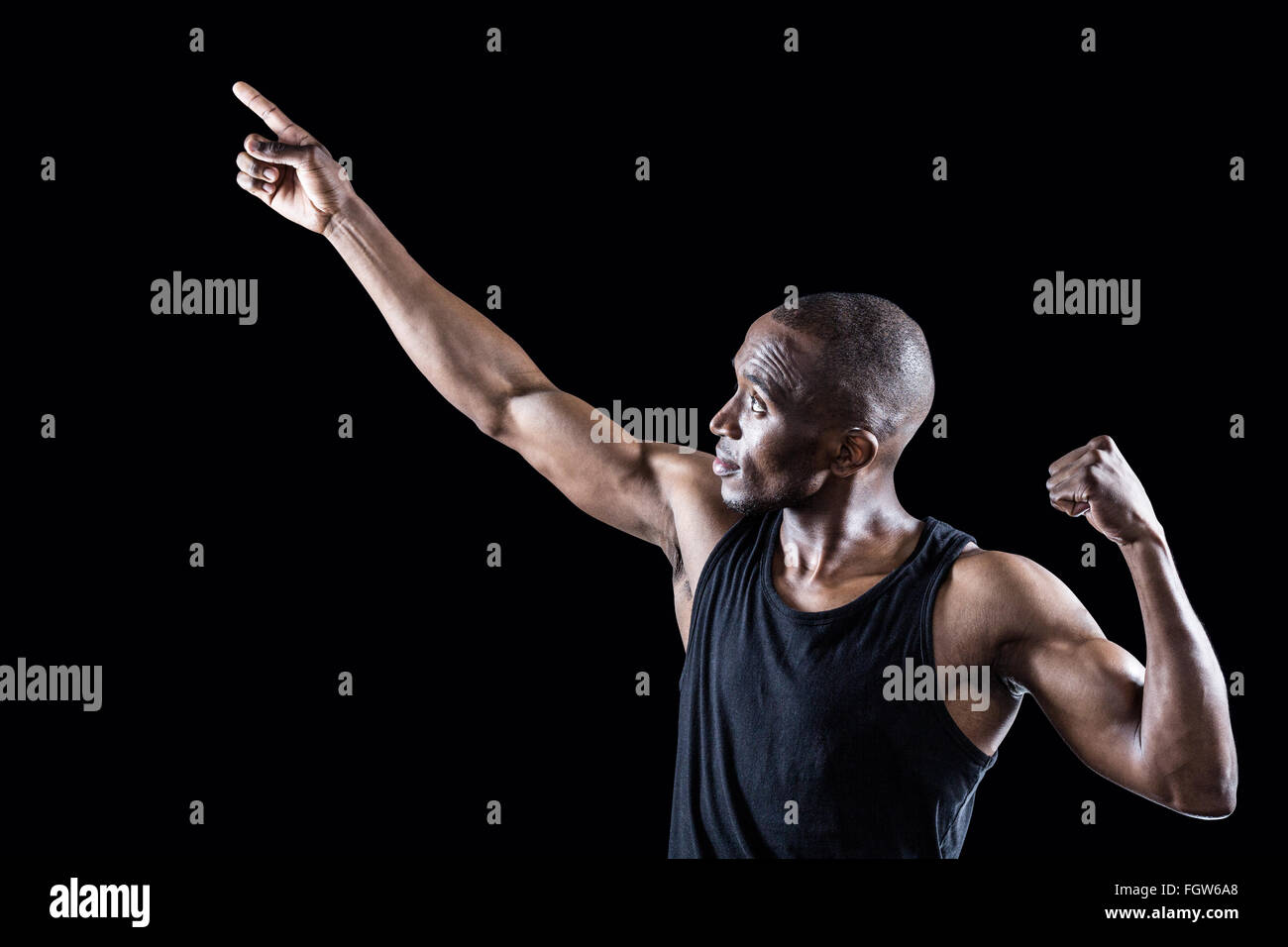 Muscular man pointing while standing Stock Photo - Alamy