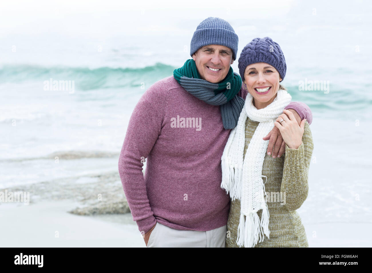 Smiling happy couple hugging each other Stock Photo - Alamy