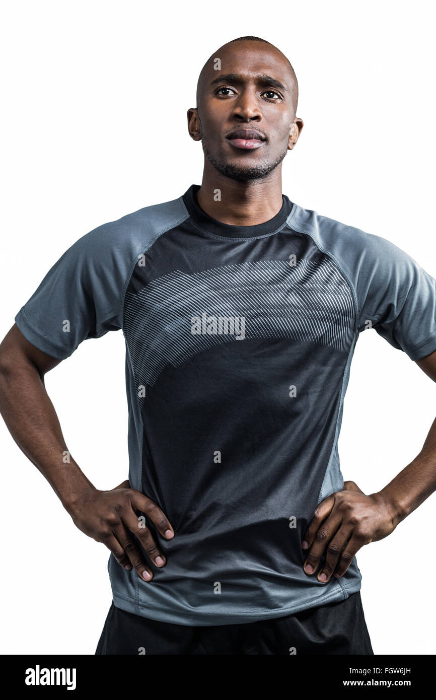 Confident athlete with hand on hip Stock Photo - Alamy